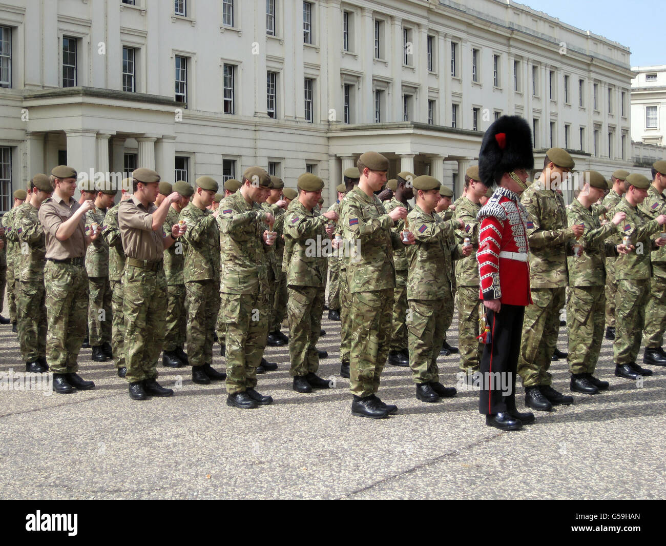 More than 100 Coldstream and Grenadier Guards line up to dip toast ...