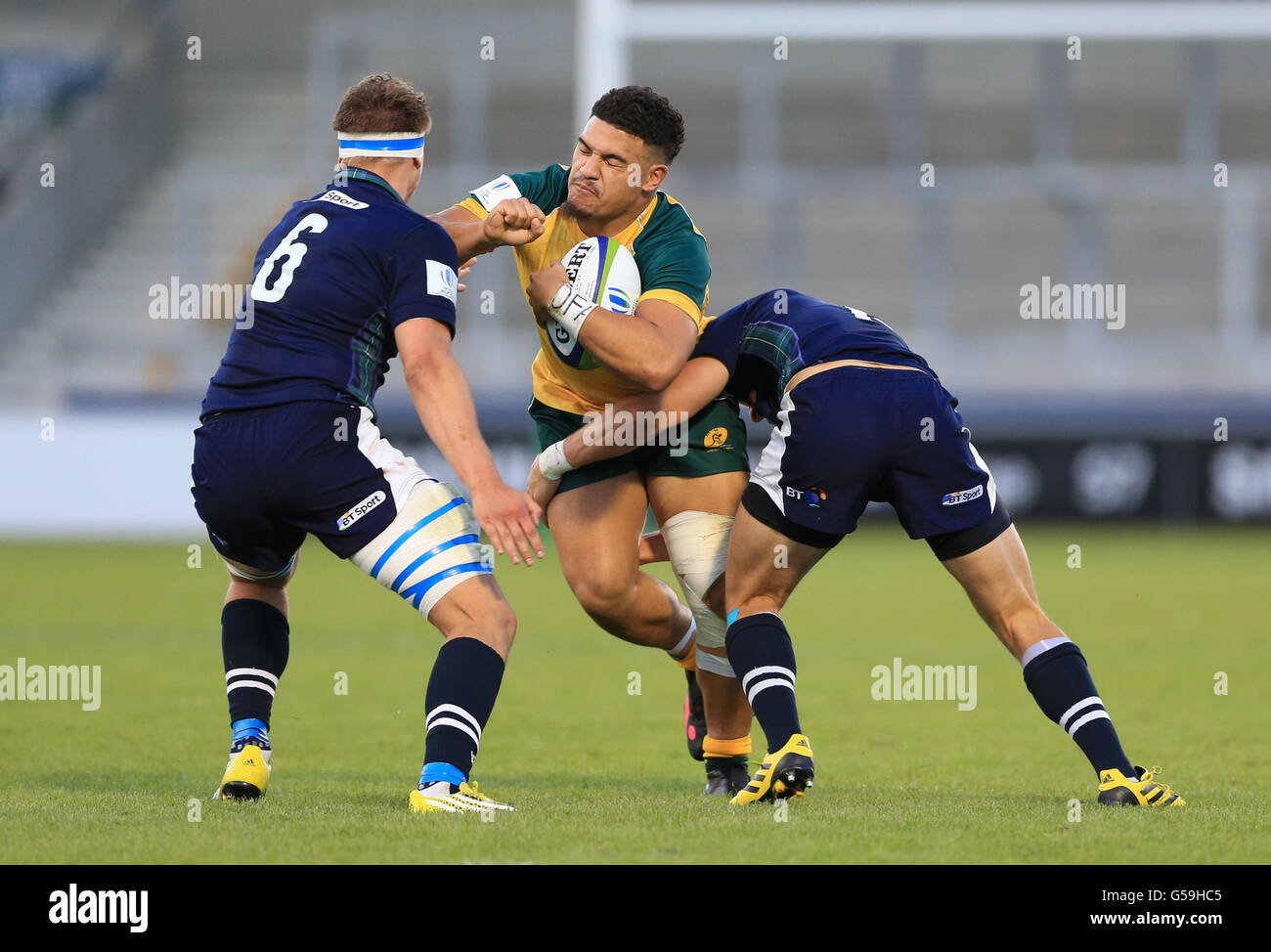 Australia's Liam Jurd (centre) is tackled by Scotland's Jamie Ritchie ...