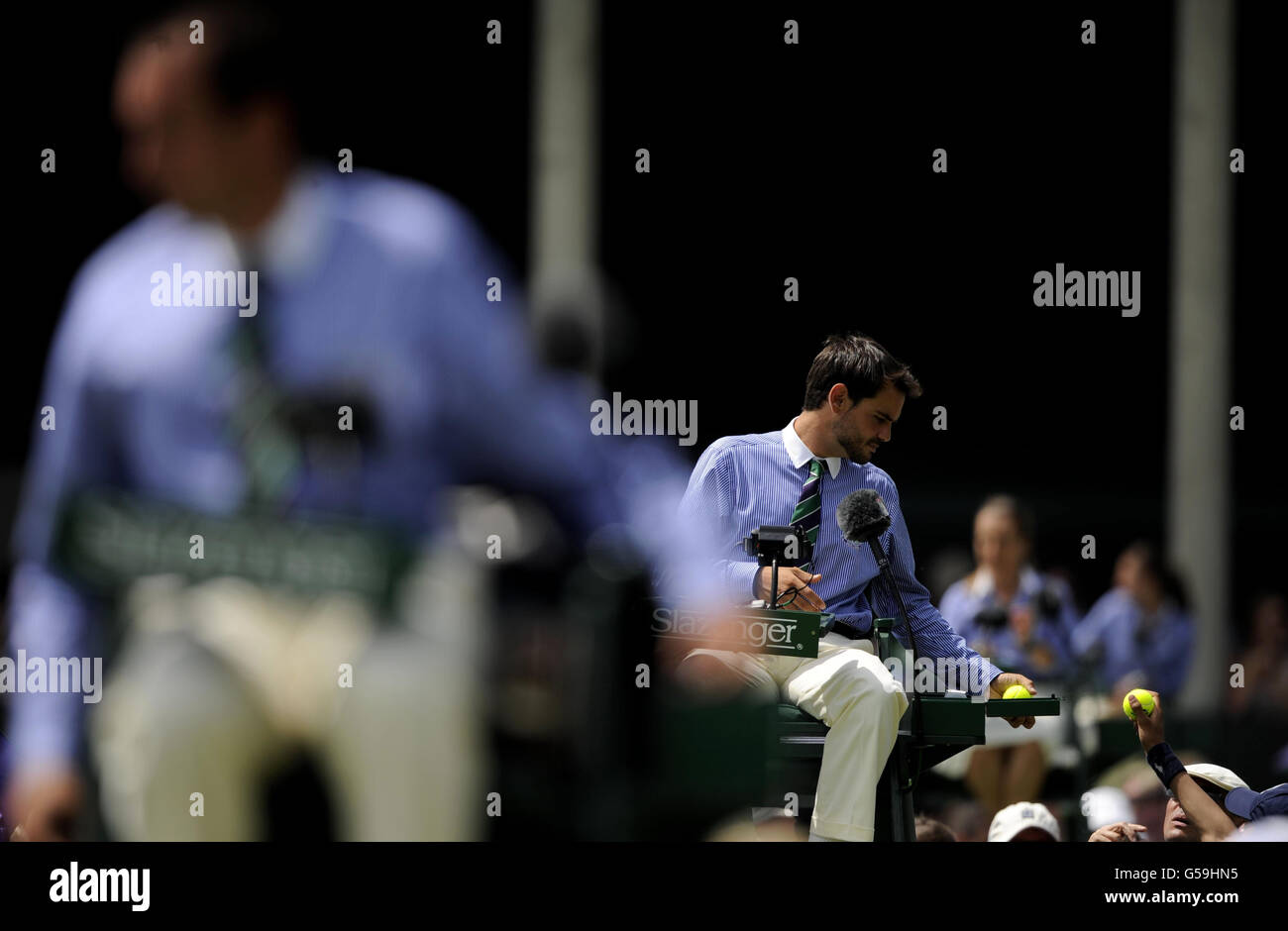 Umpires in their chairs during day four of the 2012 Wimbledon ...