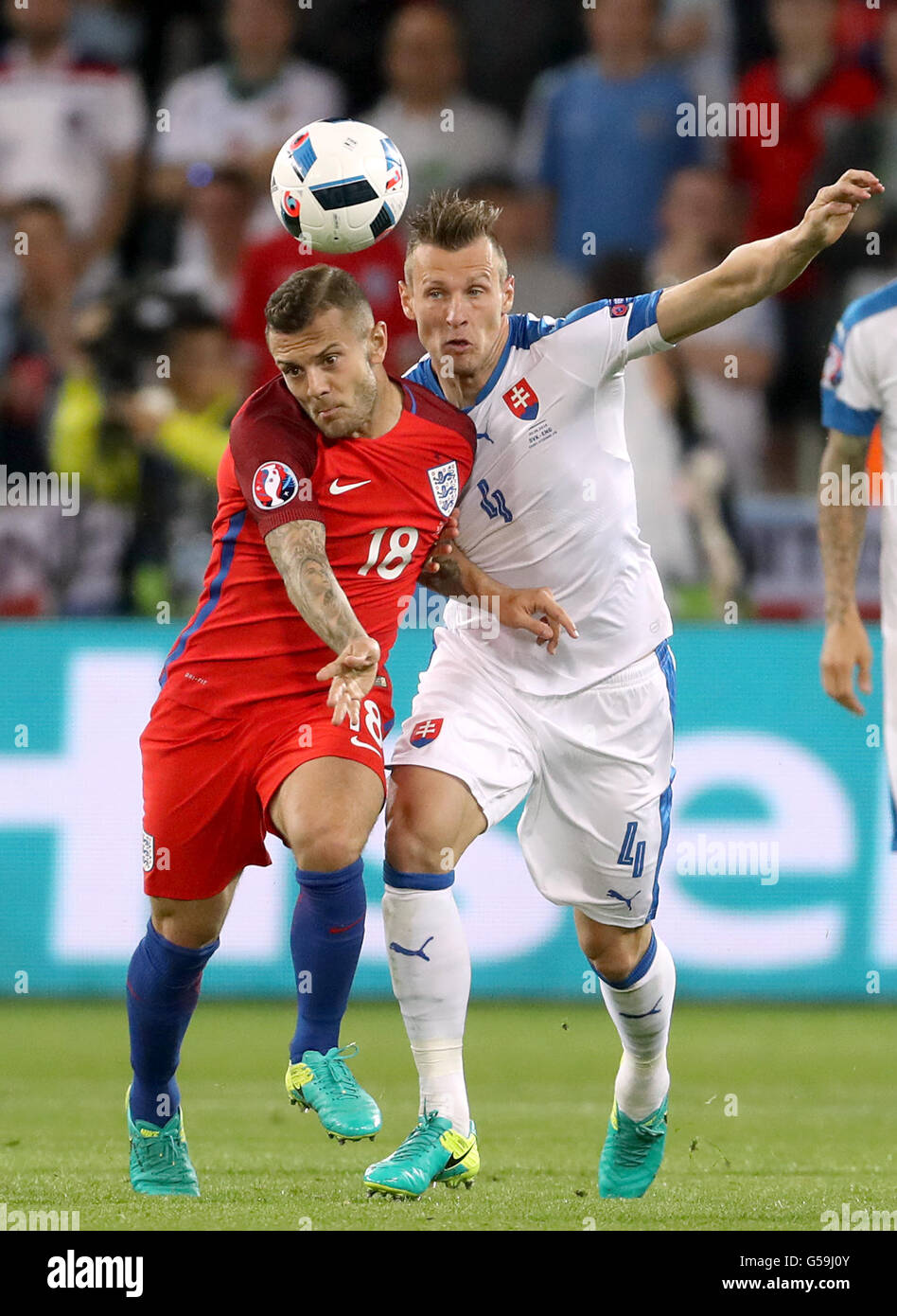 England's Jack Wilshere and Slovakia's Jan Durica (right) battle for ...