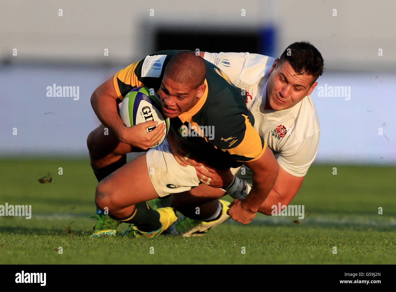 South Africa's Zain Davids is tackled by England's Lewis Boyce during ...