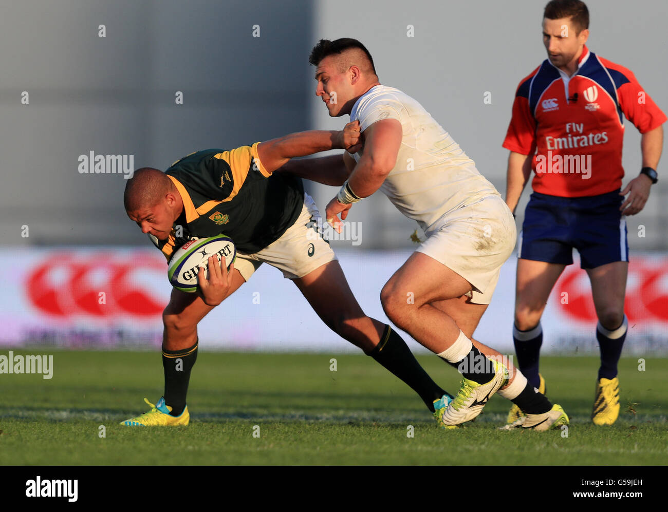 South Africa's Zain Davids is tackled by England's Lewis Boyce during ...
