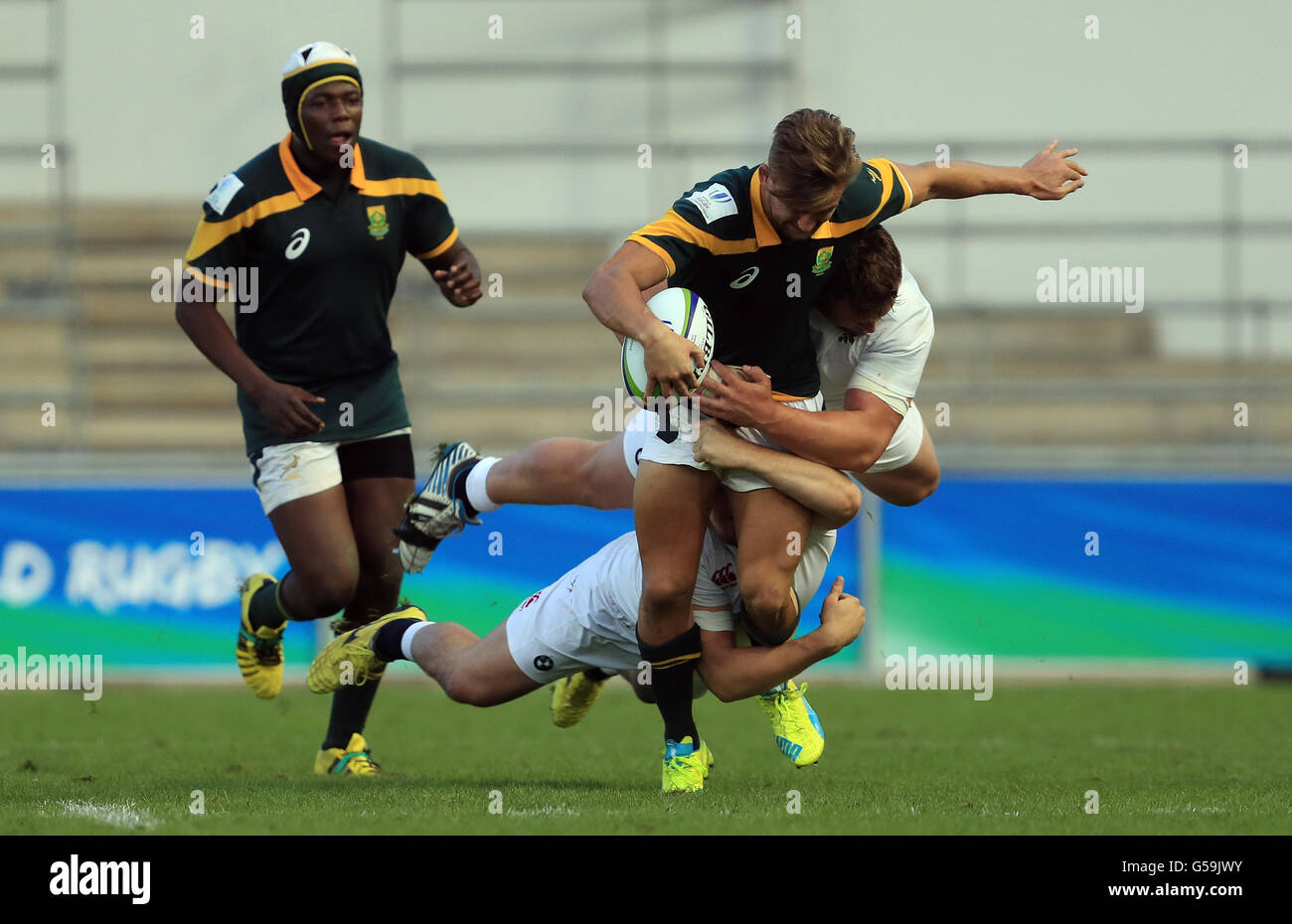 South Africa's Jeremy Ward is tackled by England's Will Stuart and ...
