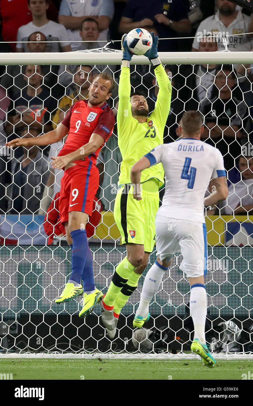 Slovakia goalkeeper Matus Kozacik (centre) claims the ball from England ...