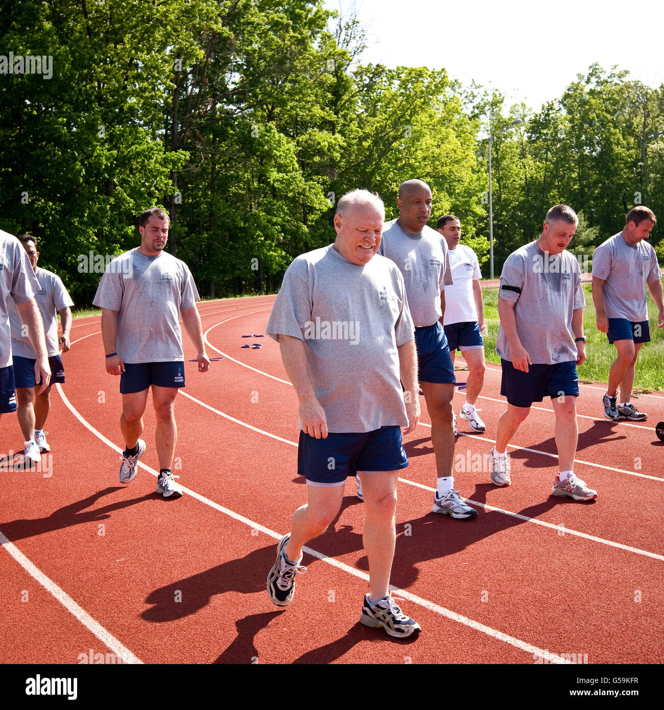 Police officers from around the country and abroad exercise on a track ...