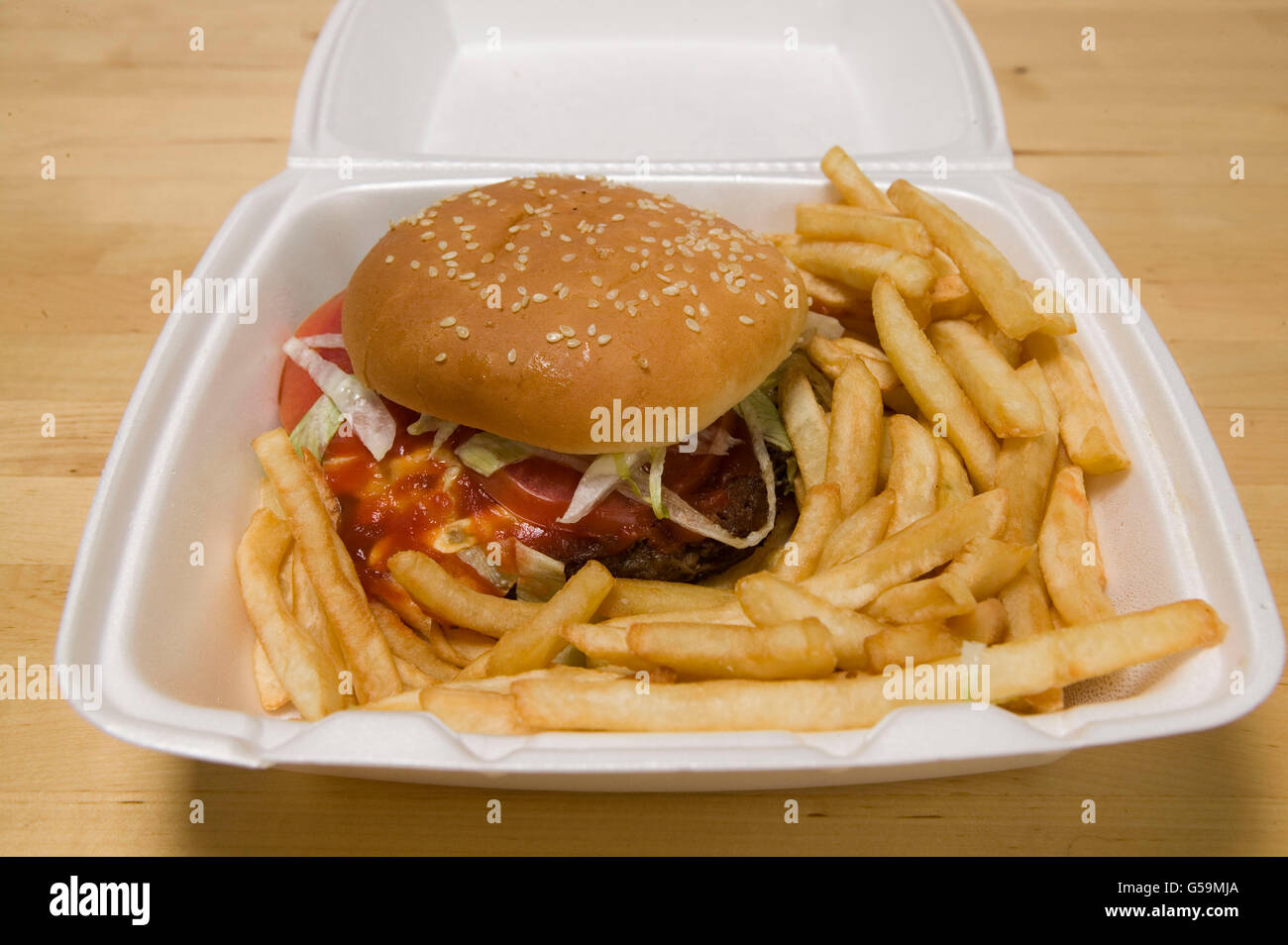 Illustration image showing a cheeseburger and French fries in plastic ...