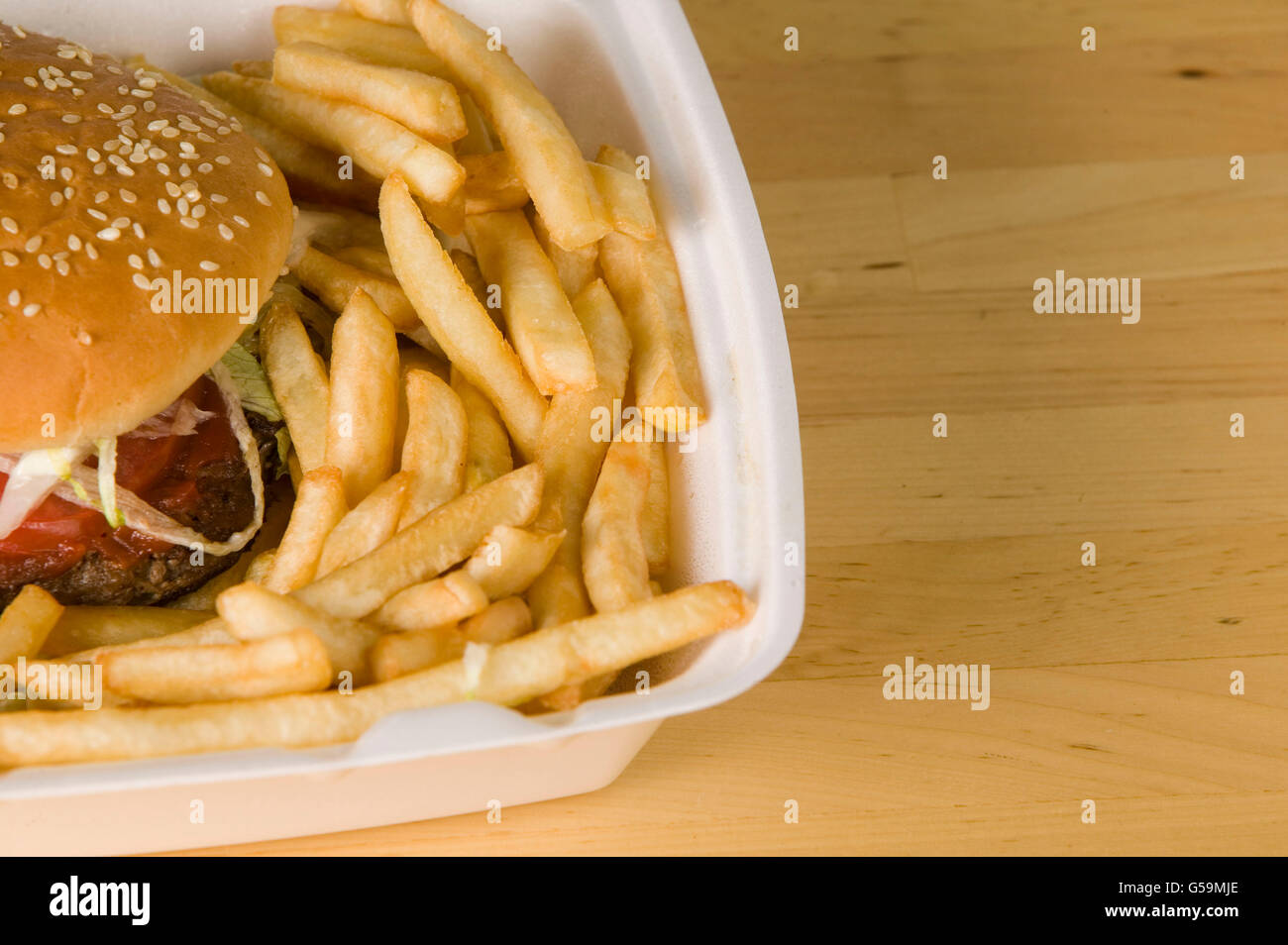 Illustration image showing a cheeseburger and French fries in plastic ...