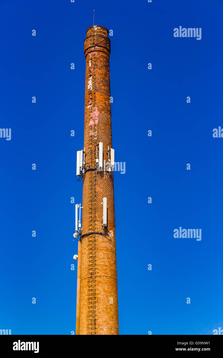 old brick chimney as cell towers Stock Photo - Alamy