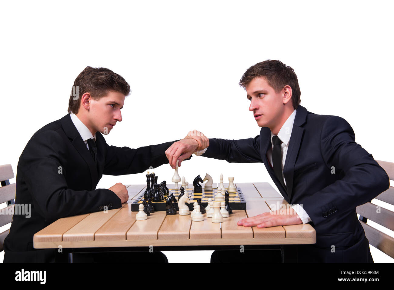 Twin brothers playing chess isolated on white Stock Photo - Alamy