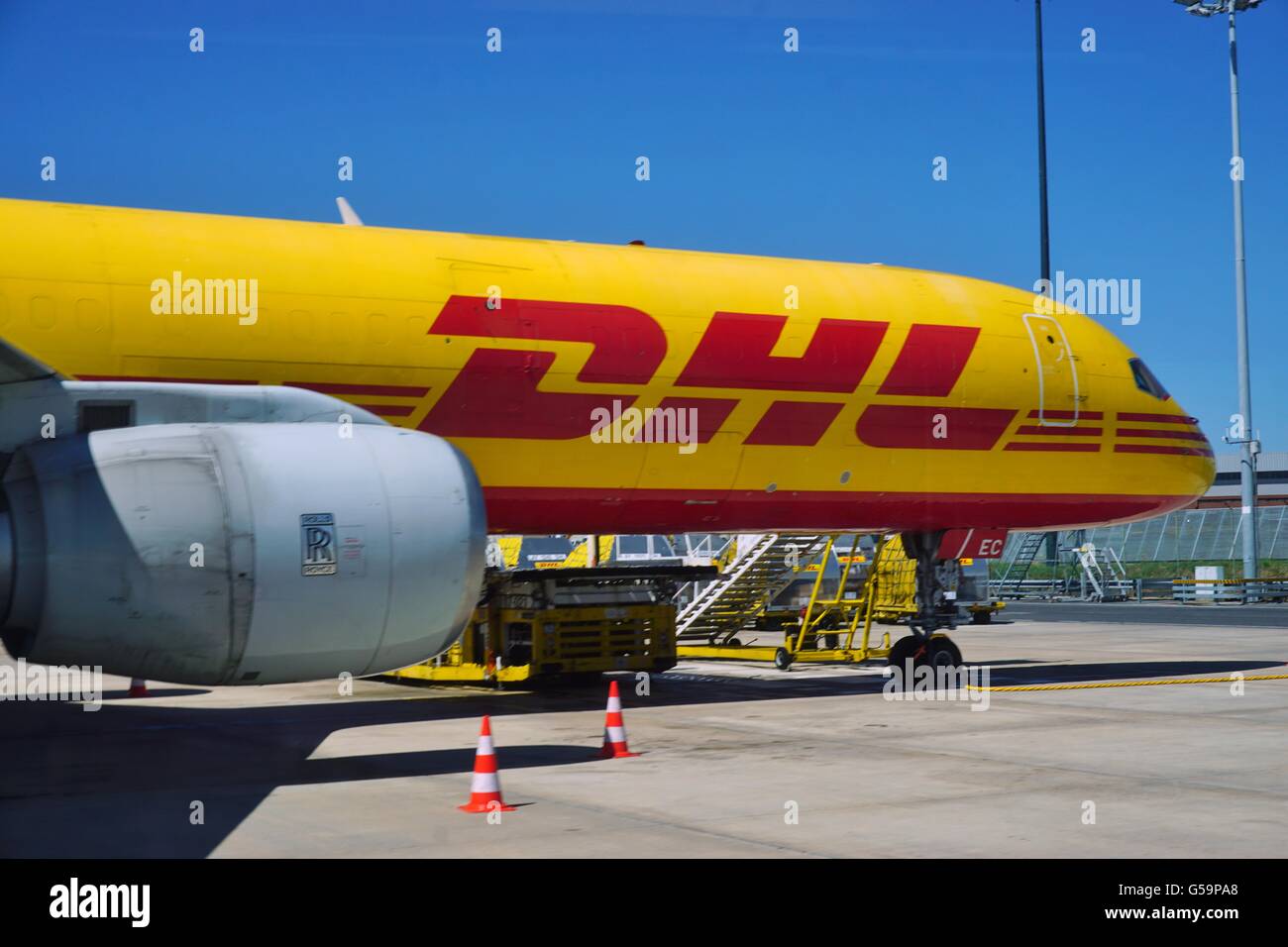 A yellow and red Boeing 757 airplane from international shipping ...