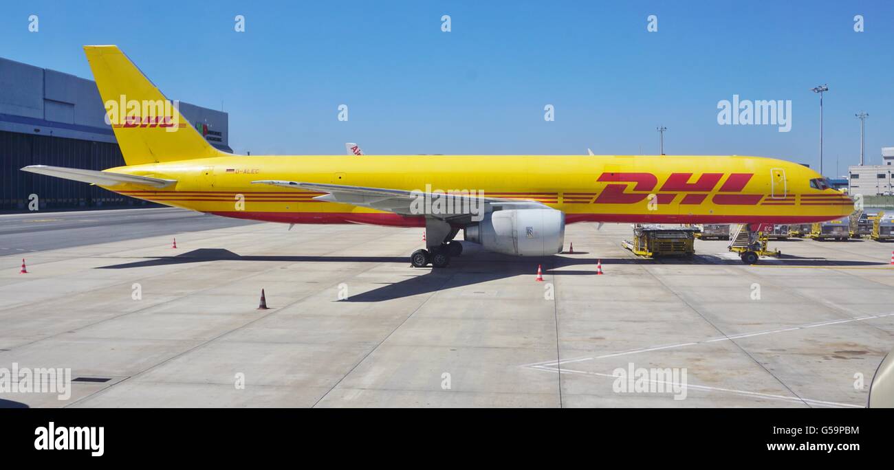 A yellow and red Boeing 757 airplane from international shipping ...