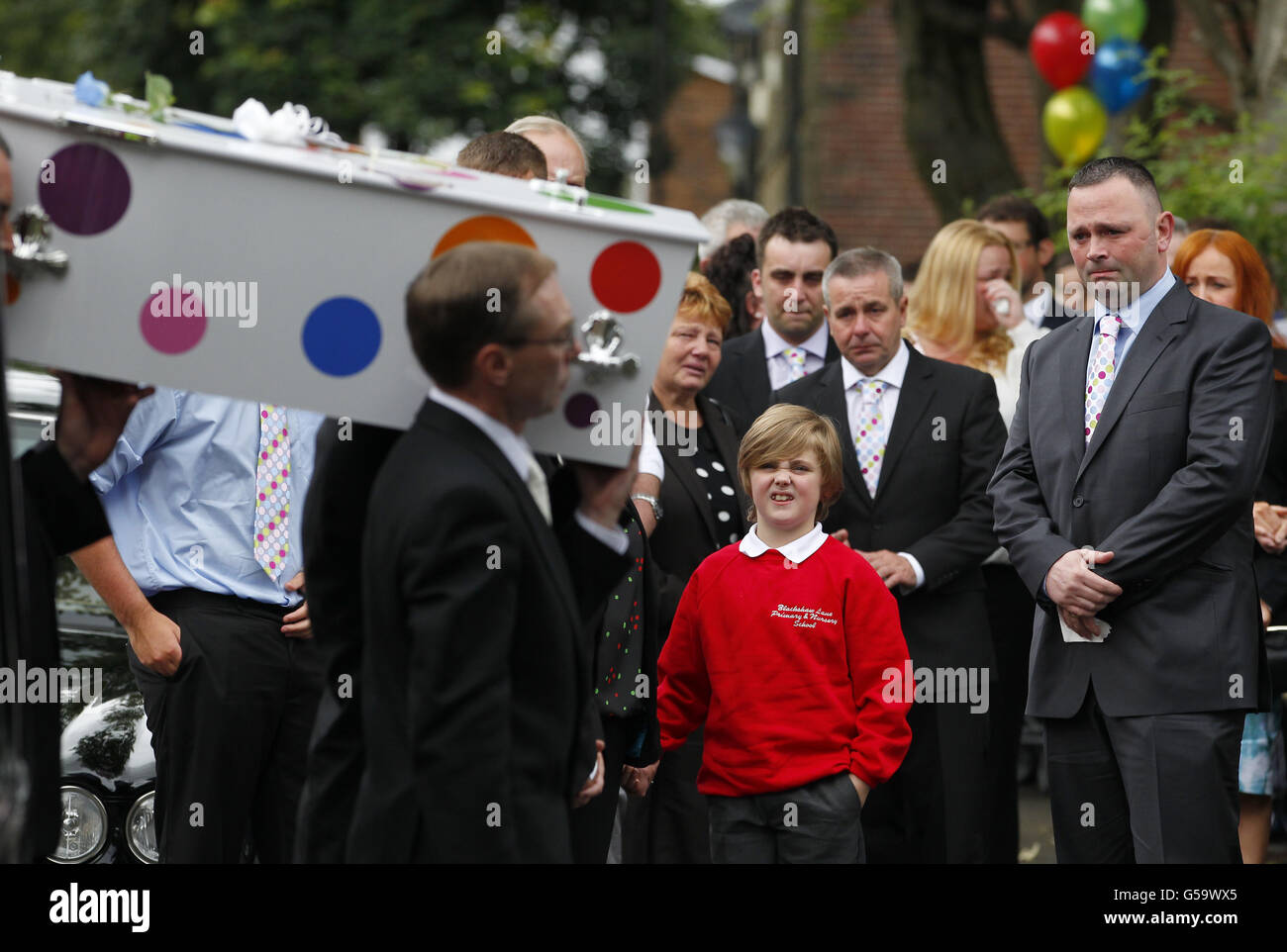 Kenny Heaton, (right), stands alongside his son Jake, (red jumper), as ...