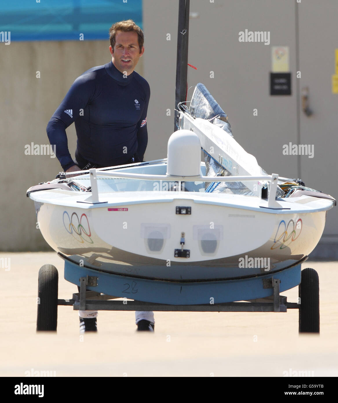 Great Britain's Ben Ainslie rigs his Finn dinghy before practicing on ...