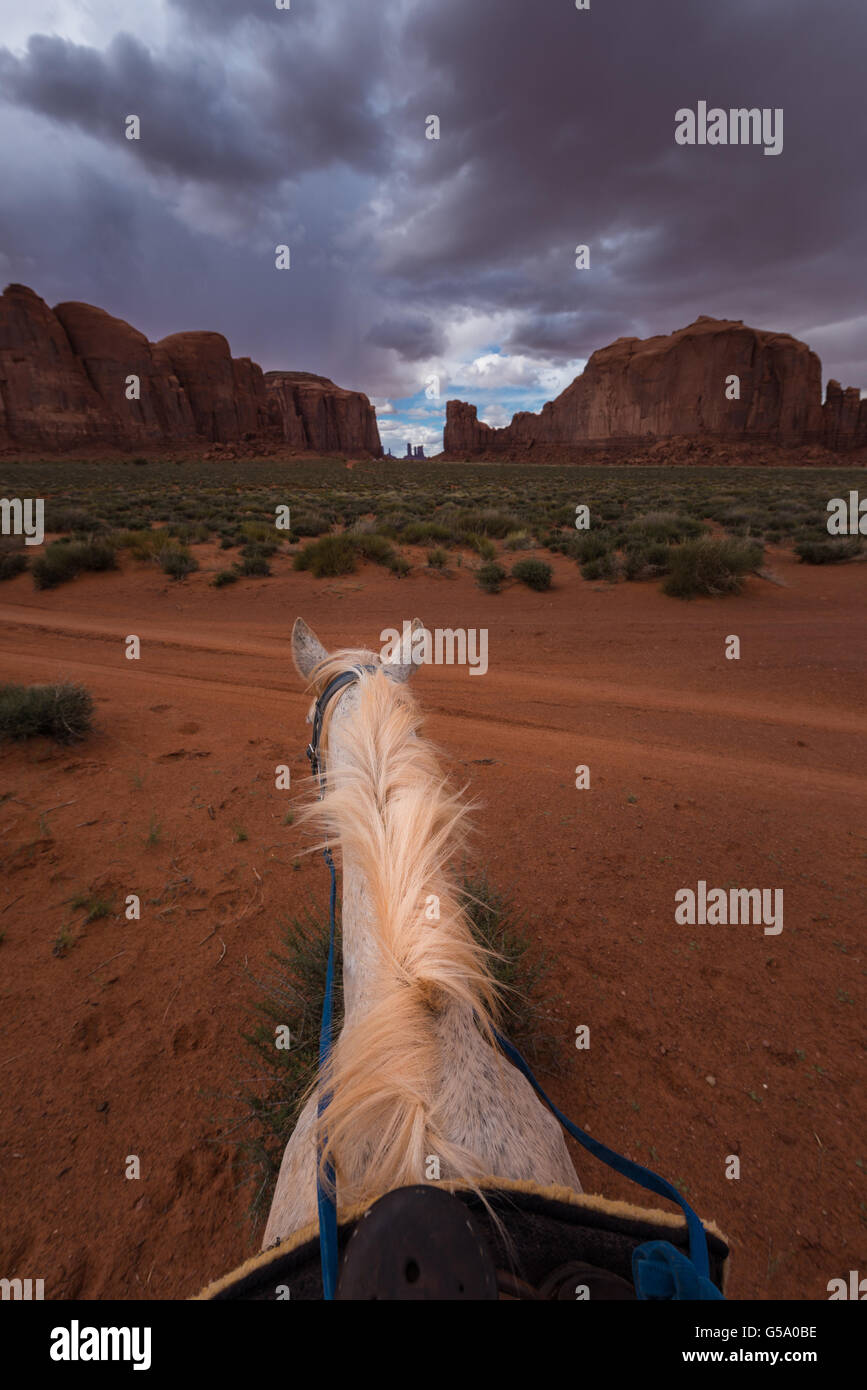 Monument Valley Horseback Riding first person view with dramatic clouds ...