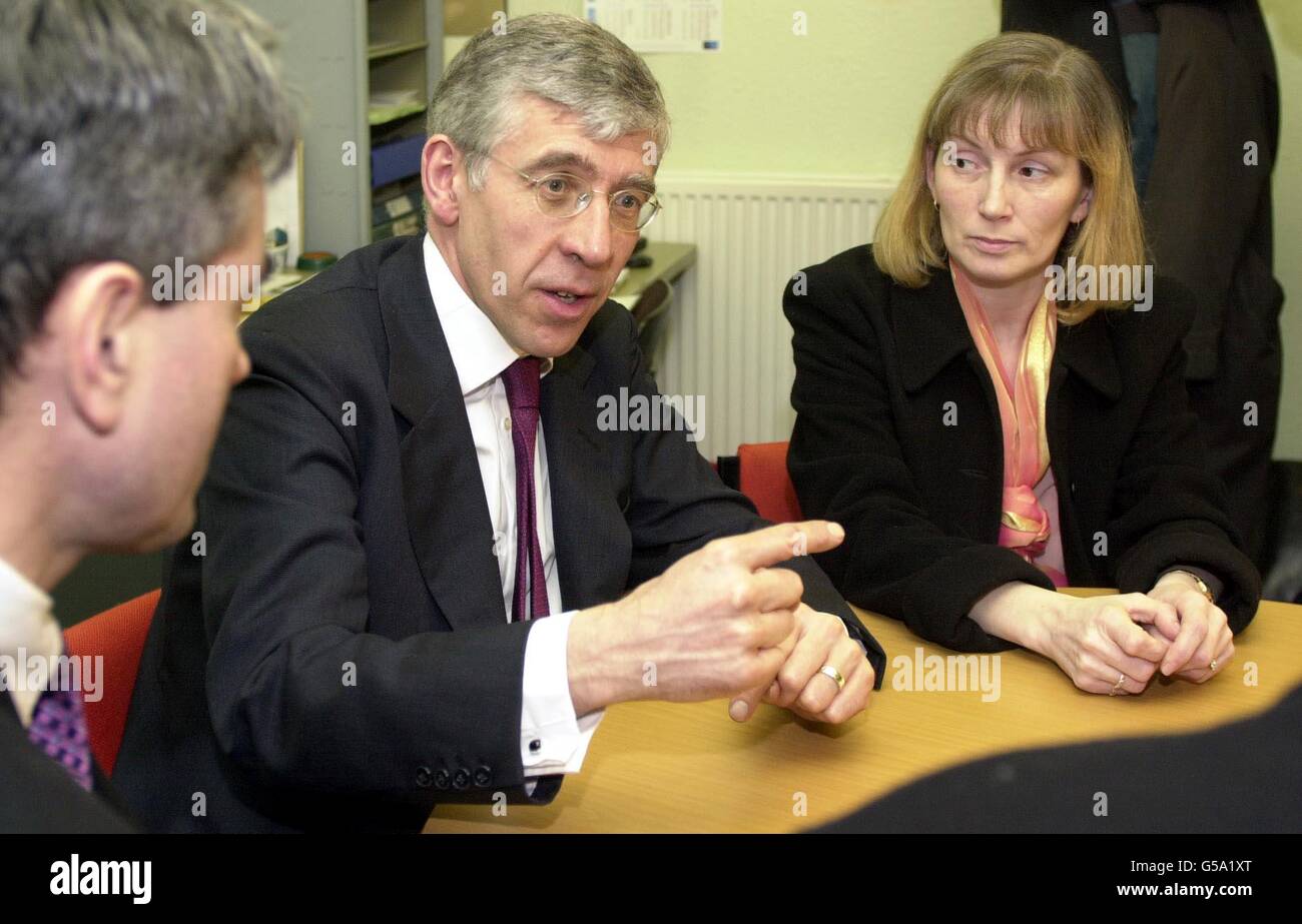 Crime victim Carol Hackney (R) listens as Home Secretary Jack Straw ...