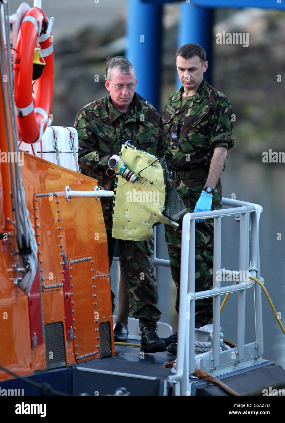 Plane wreckage is taken off Buckie lifeboat after it arrived back in ...