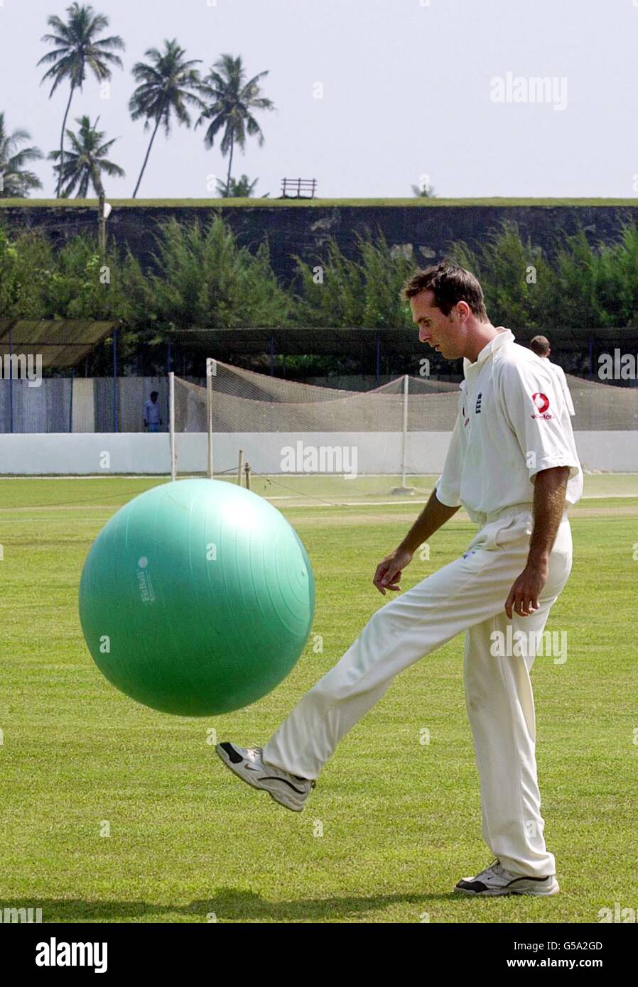 England's Michael Vaughan kicks a giant inflatable ball for fun, during ...