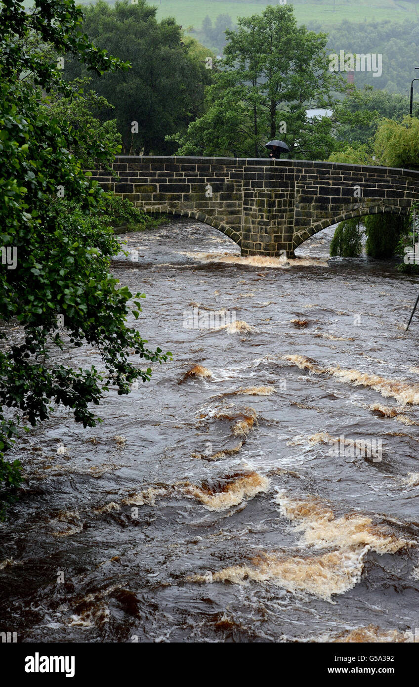 A higher than normal river calder flows through hebden bridge hi-res ...