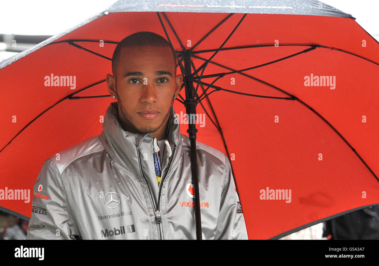 Vodafone McLaren Mercedes driver Lewis Hamilton walks down the pit lane ...