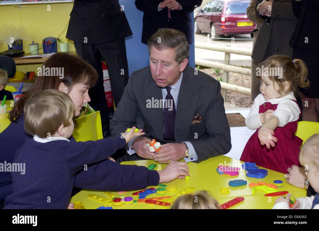 The Prince of Wales helps children to play with 'Play Dough' while at ...