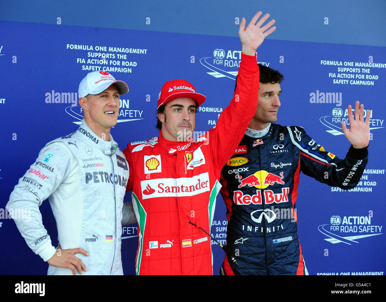 Scuderia Ferrari's Fernando Alonso (centre) after qualifying in pole ...