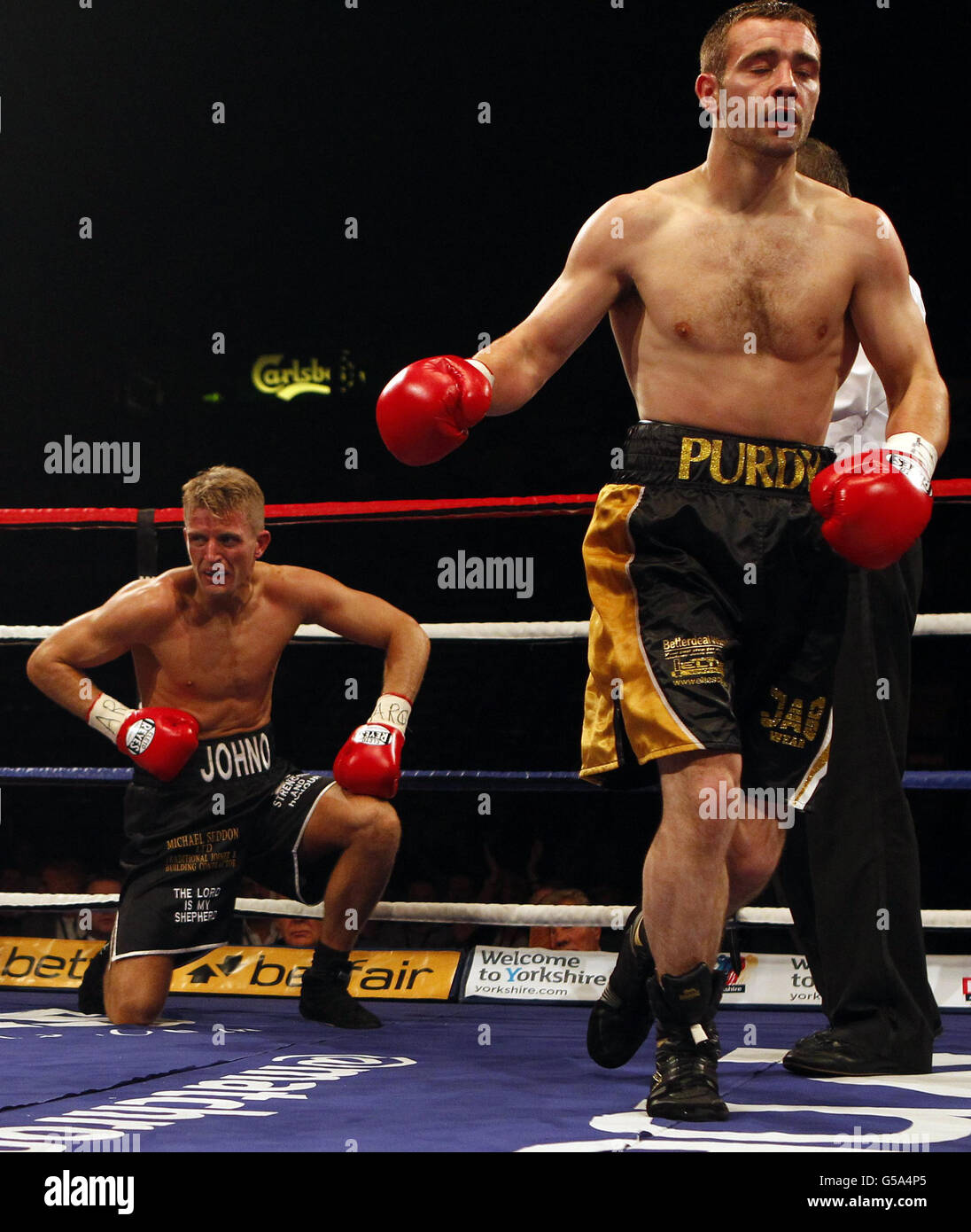 Lee Purdy knocks Chris Johnson to the canvas during their English ...