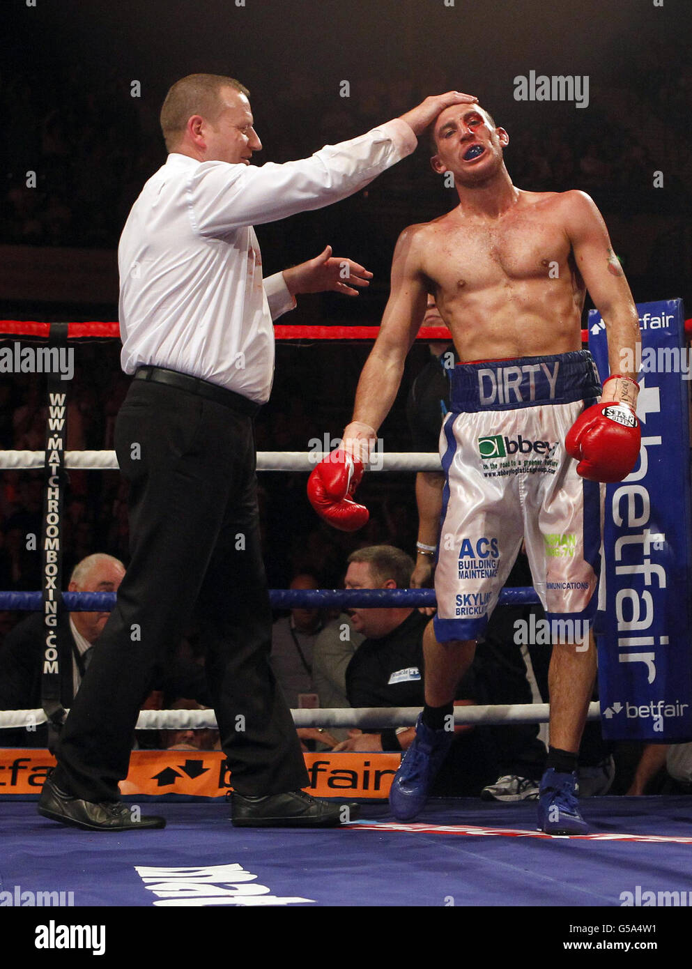 Ref Howard Foster stops the fight after Gavin Rees (not pictured ...