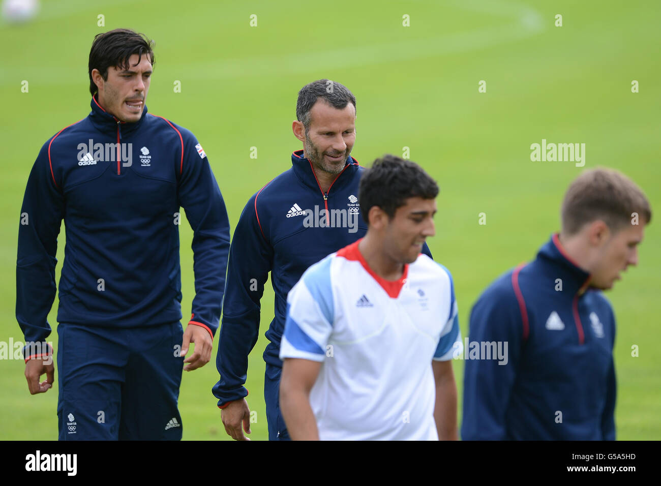Great Britain captain Ryan Giggs (centre) with James Tomkins (left ...