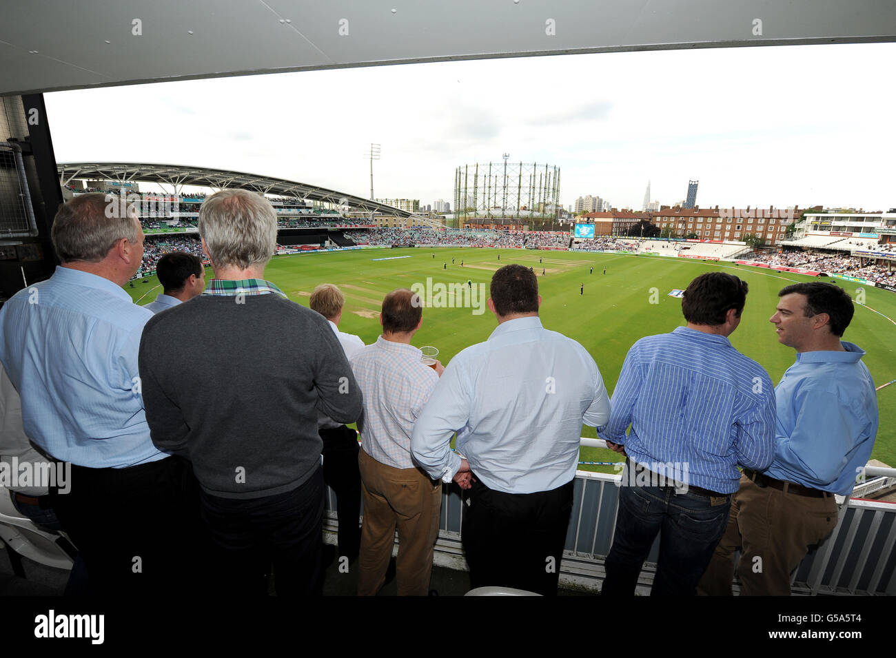 Corporate fans enjoy a premium view of the match action in the VIP area ...