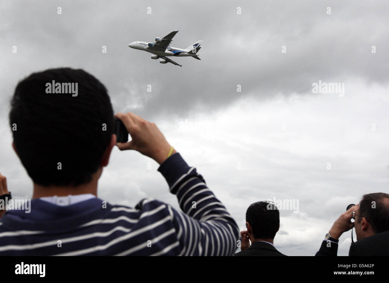 The Malaysia Airlines Airbus A380 plane performs a flypast at the ...