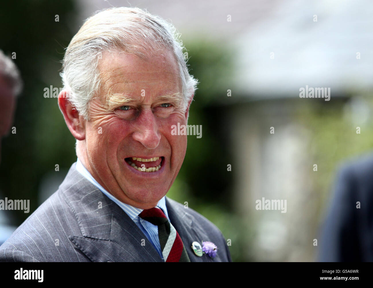 The Prince of Wales laughs as he is shown the restored Felin Ganol Mill ...