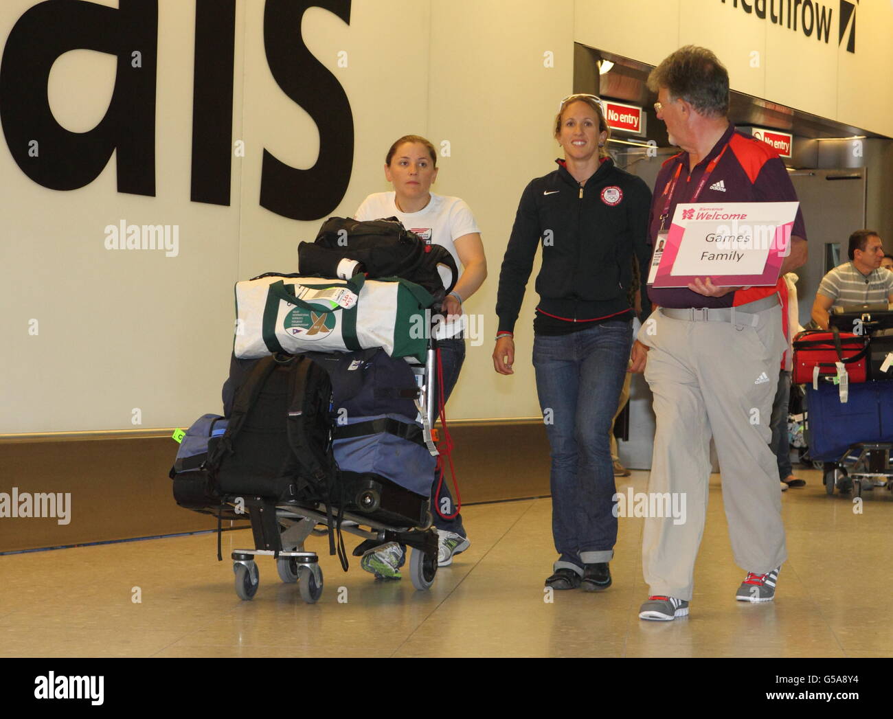Members of the USA Olympic Team are met by LOCOG members as they arrive ...