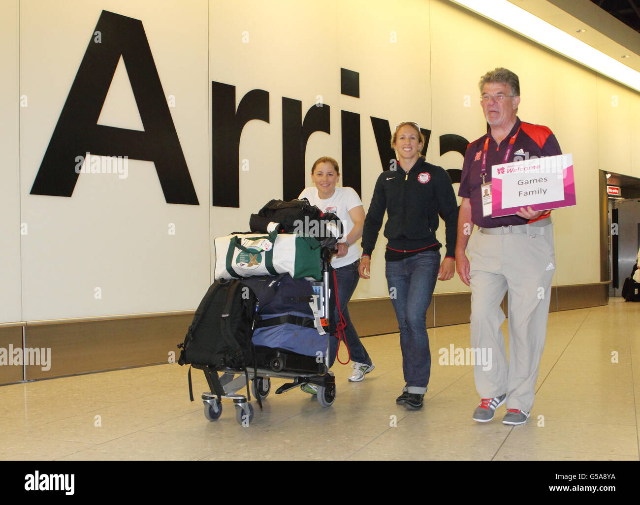 Members of the USA Olympic Team are met by LOCOG members as they arrive ...