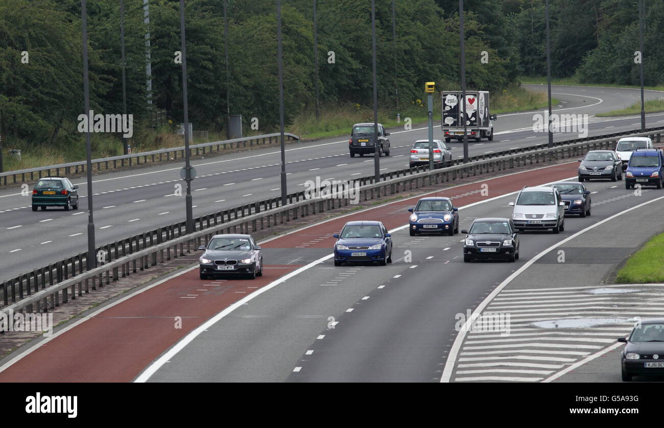 An official Olympics vehicle (left) uses the first of the Olympic Route ...