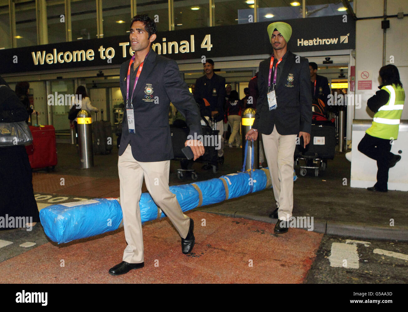 Members of the indian olympic team arrive at heathrow airport hi-res ...