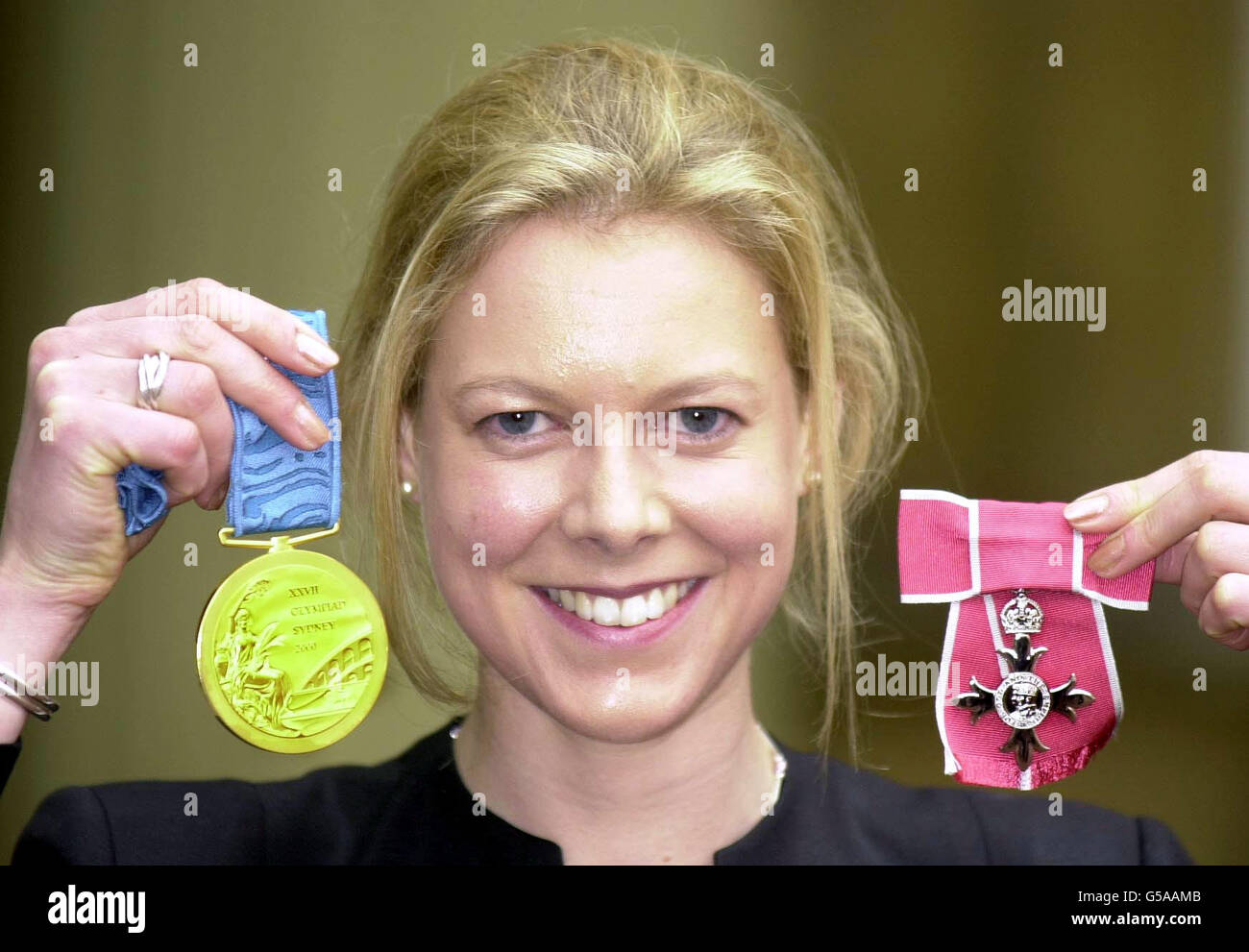 Athlete Stephanie Cook with her 2000 Olympic gold medal, which she won ...