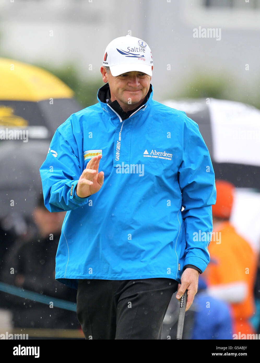 Scotland's Paul Lawrie acknowledges the crowd after his putt during day ...