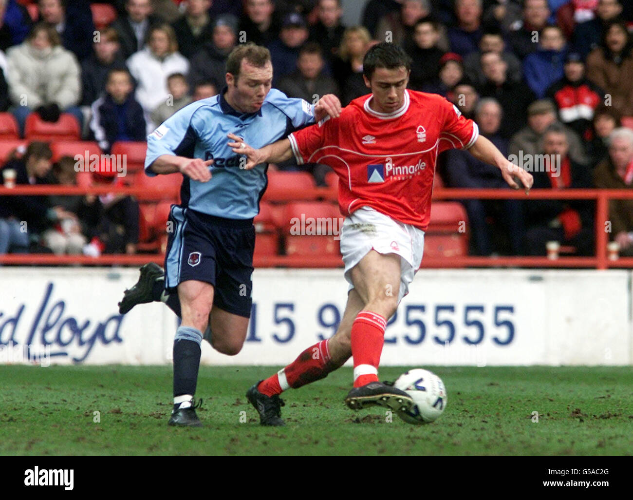 David Prutton of Nottingham Forest (right) holds off Bolton's Simon ...