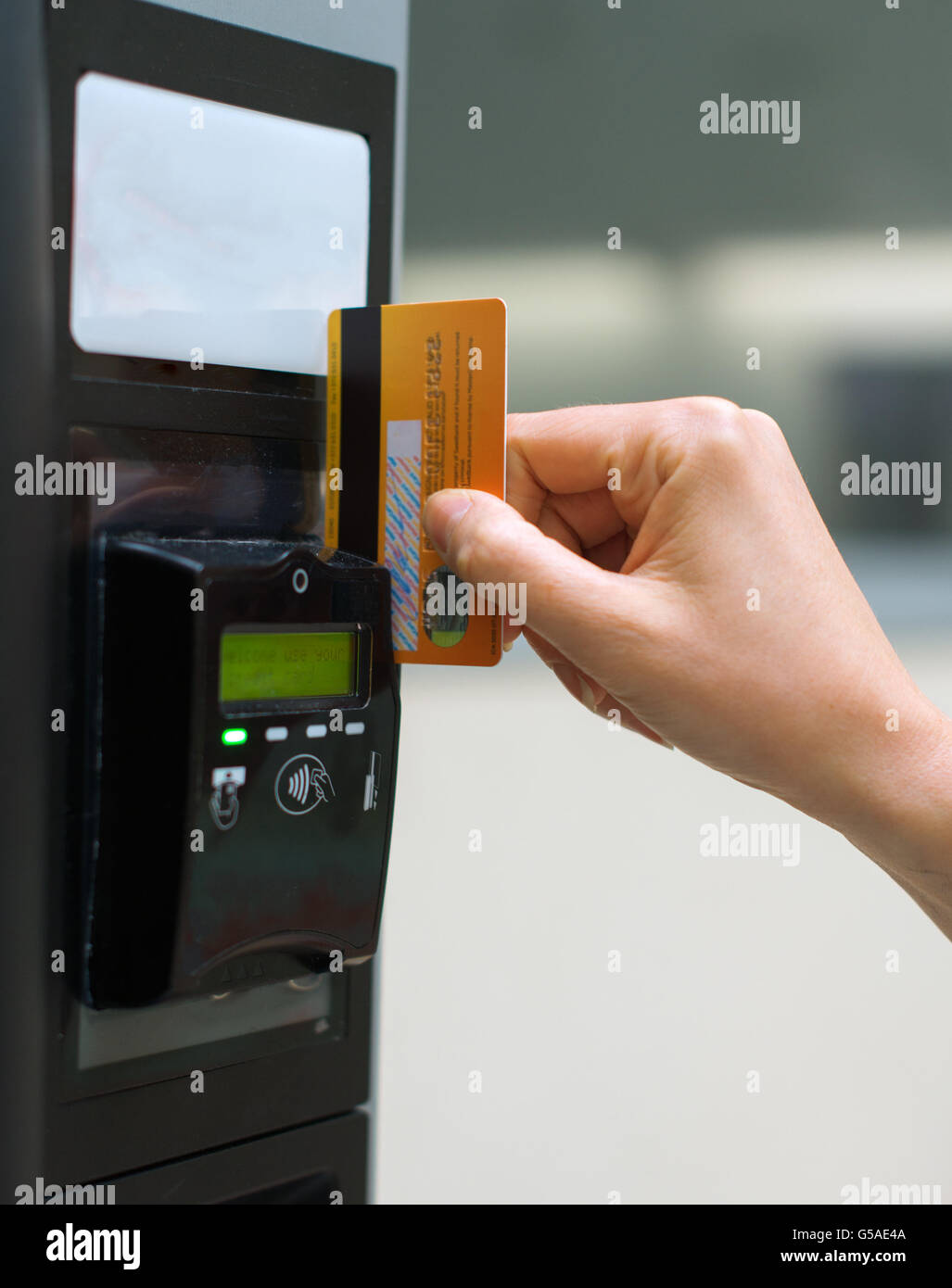 Woman using bank card in payment terminal Stock Photo - Alamy