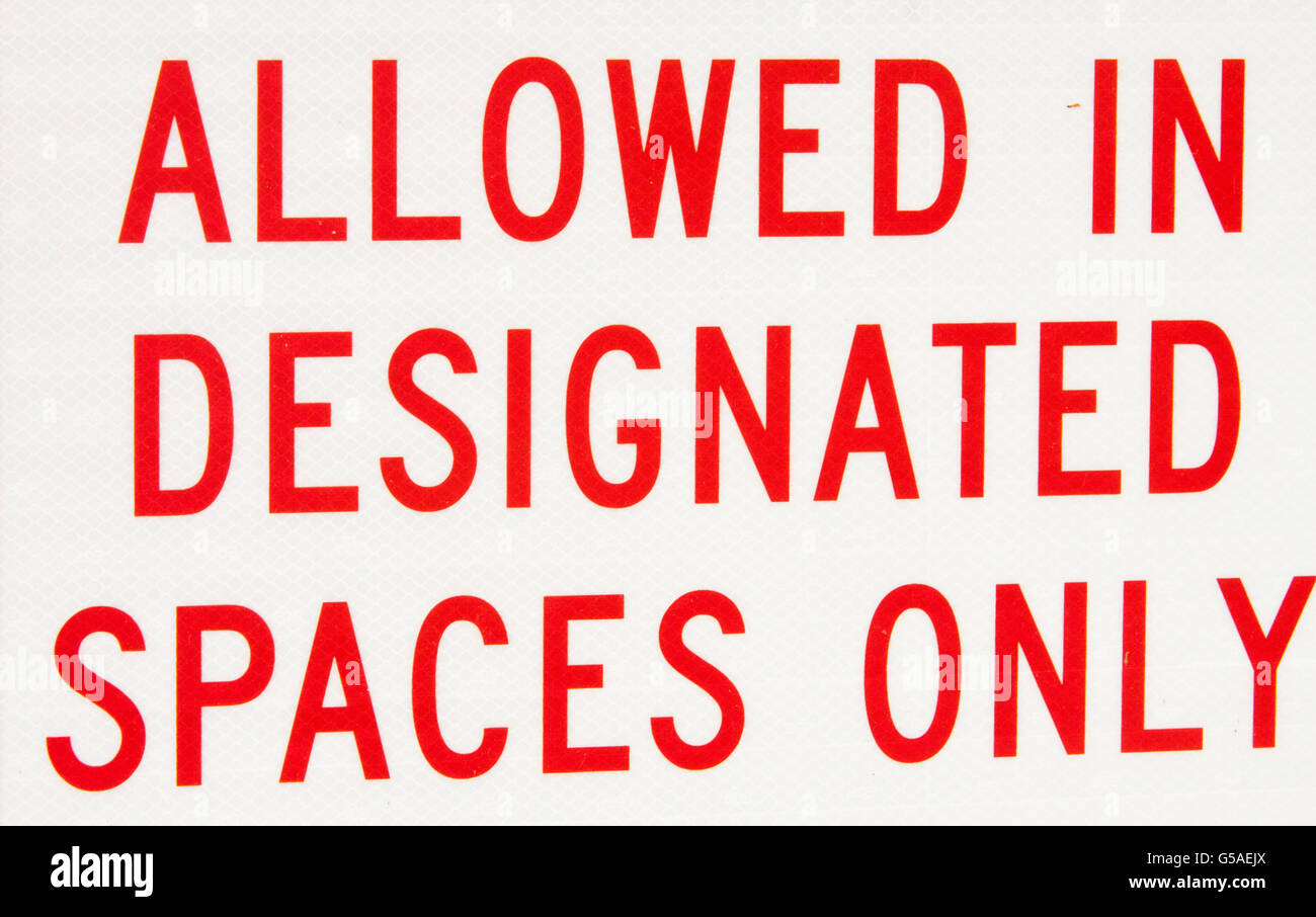 Allowed in Designated Spaces Only Sign Stock Photo - Alamy