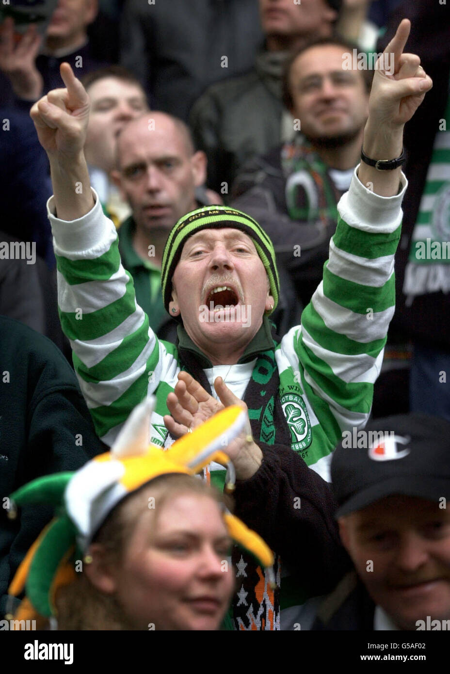 A Celtic fan celebrates his team's victory over rivals Rangers after ...