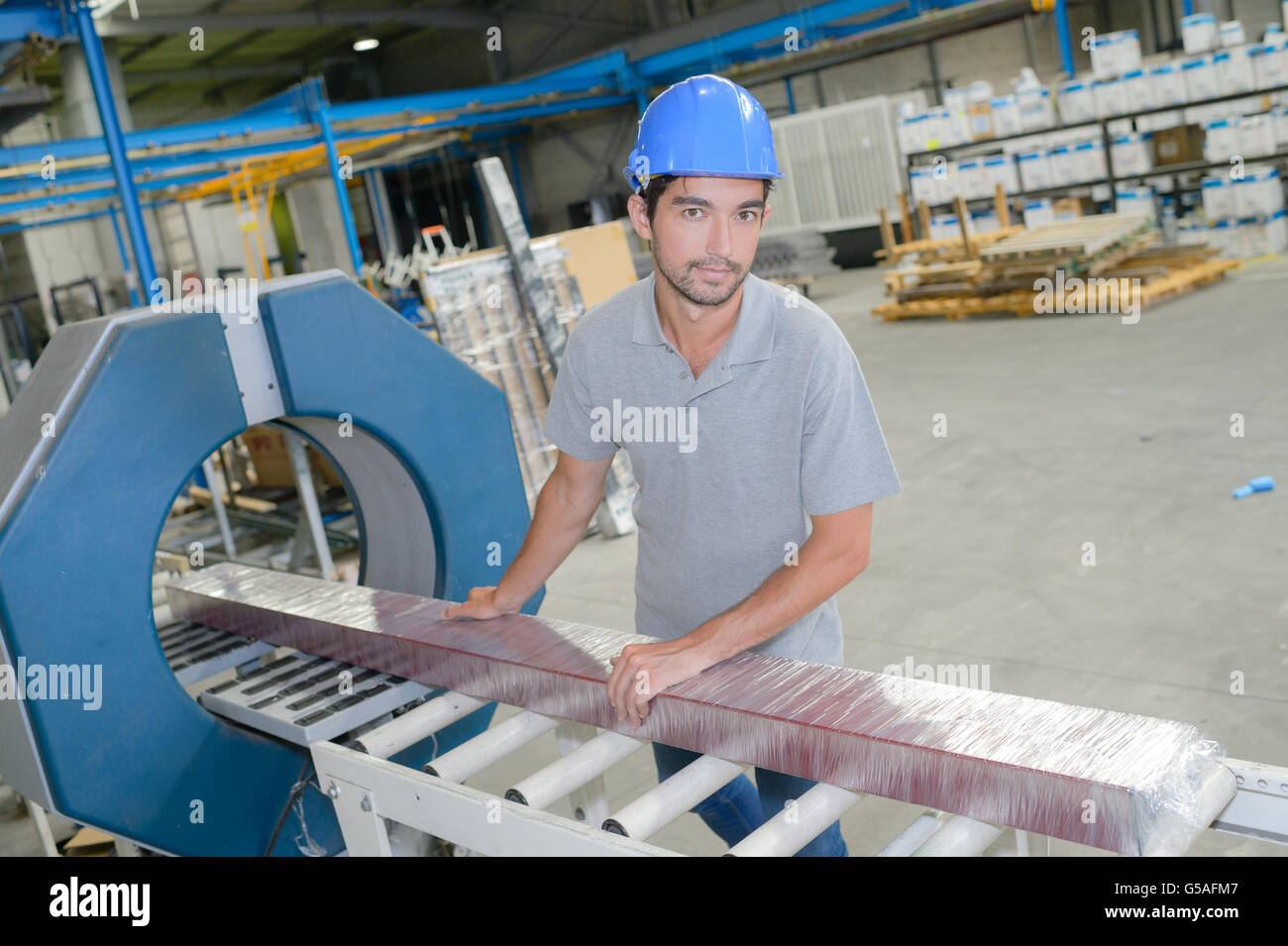 Portrait of man working on production line Stock Photo - Alamy