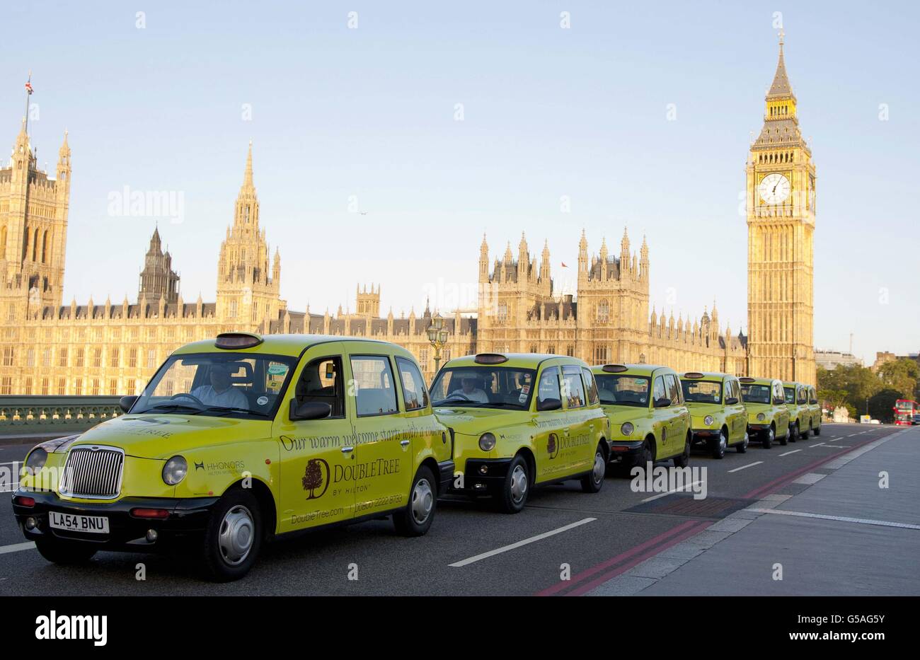 Some of the exclusive fleet of 30 branded taxis drive passed the House ...