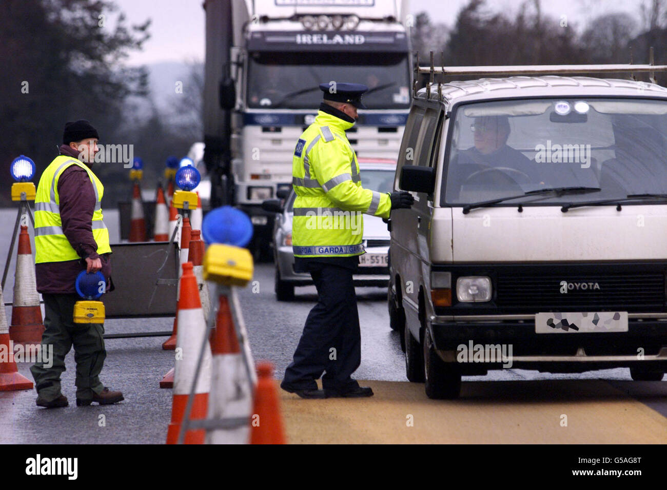 Garda officers check vechicles at the border crossing outside Dundalk ...