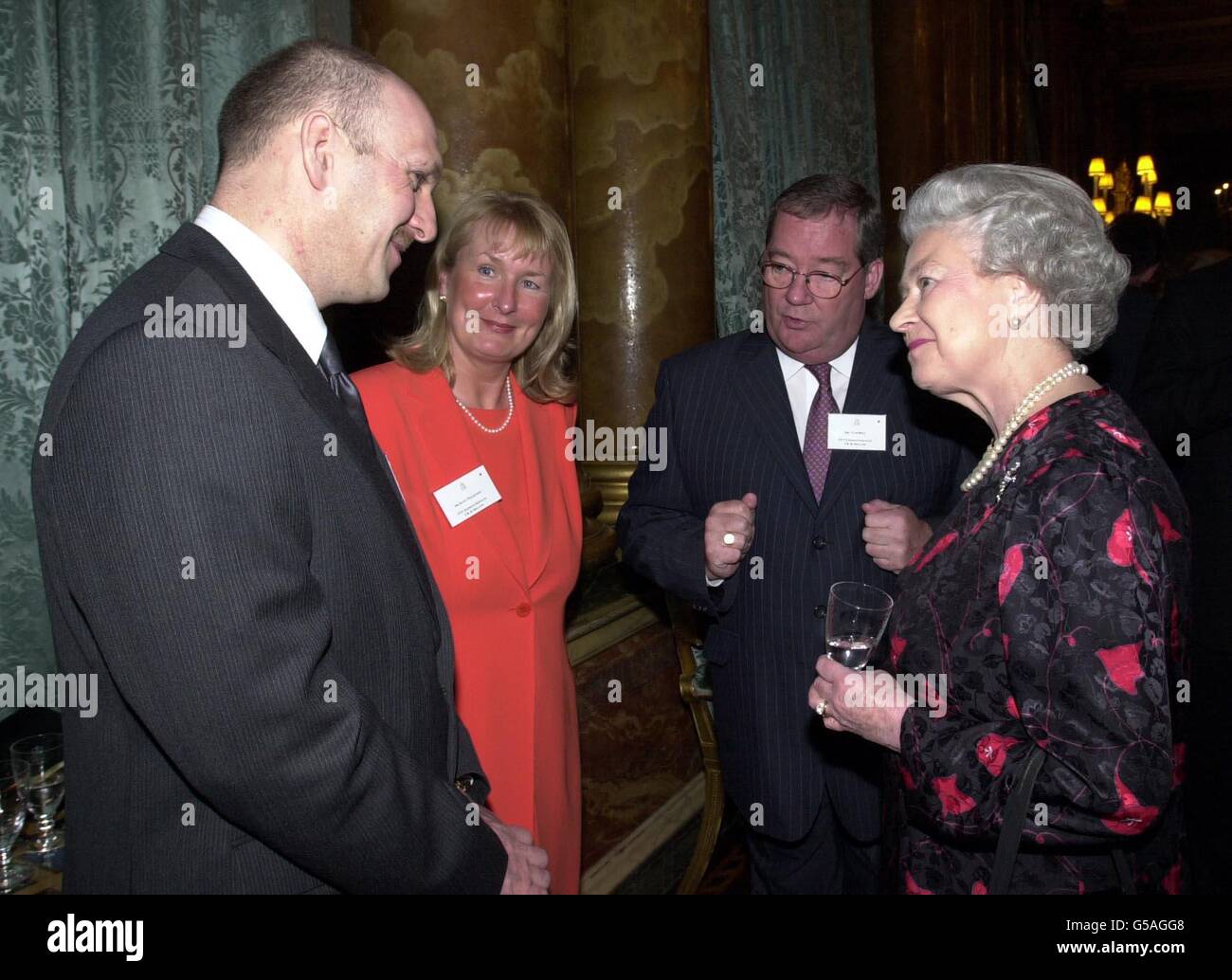 Britain's Queen Elizabeth II meets from left, Mr Simon Barnes, Ms Dawn ...