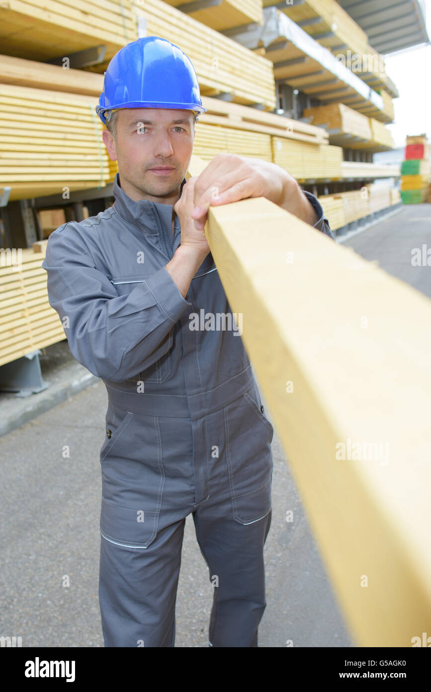 Man carrying plank hi-res stock photography and images - Alamy