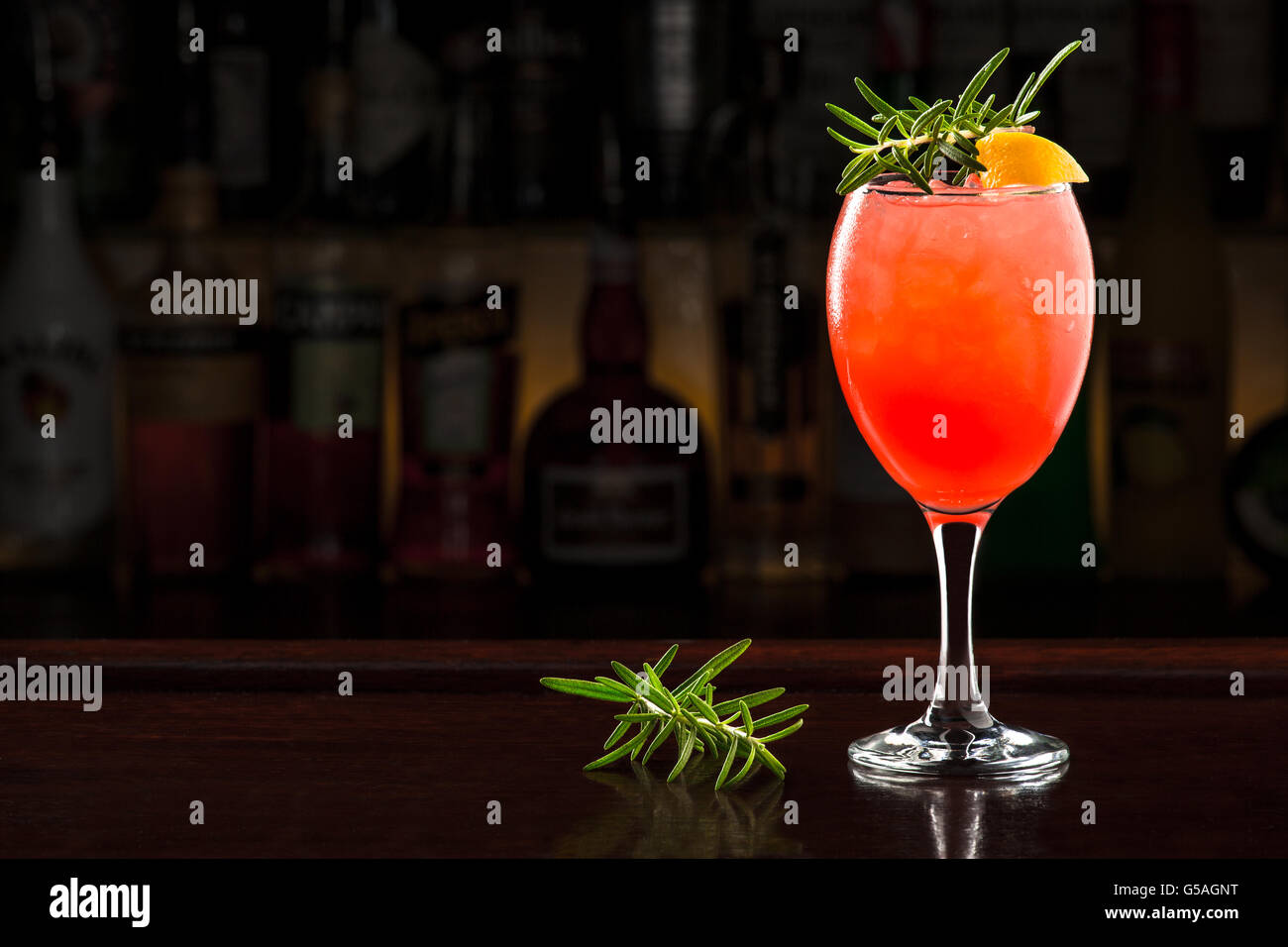 Raspberry cocktail with rosemary, served in vine glass Stock Photo - Alamy