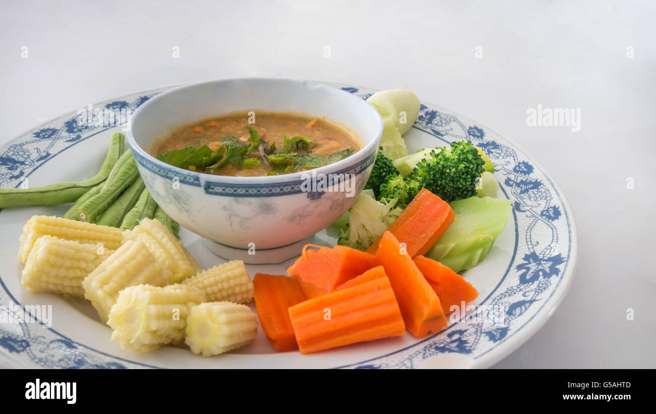 Spicy crab roe chili sauce served with vegetable on dish Stock Photo ...