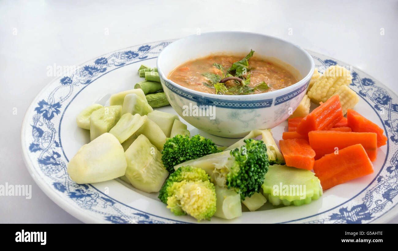 Spicy crab roe chili sauce served with vegetable on dish Stock Photo ...