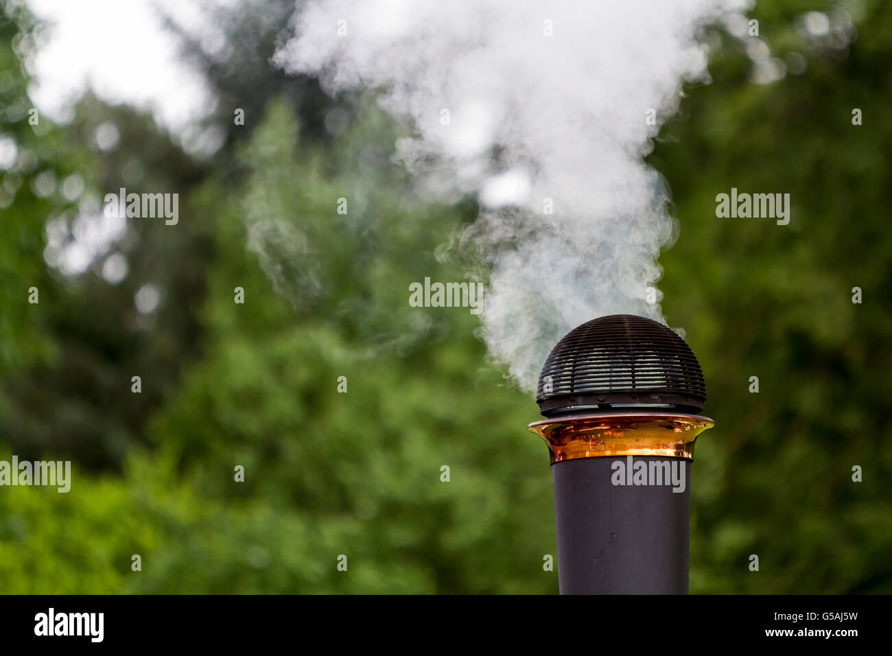 Chimney of a traction engine with smoke and a heat haze Stock Photo - Alamy